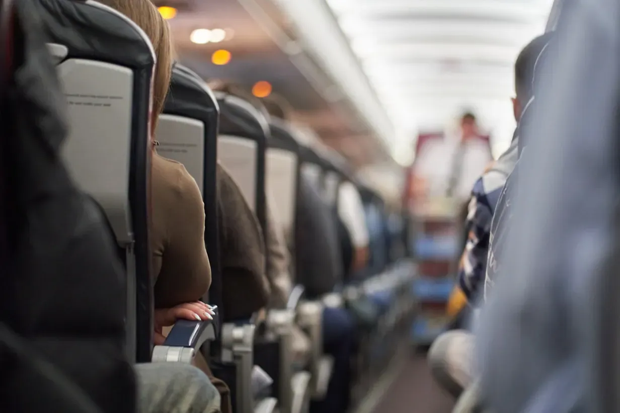 Airplane Etiquette: What to Do When Someone Invades Your Seat Space